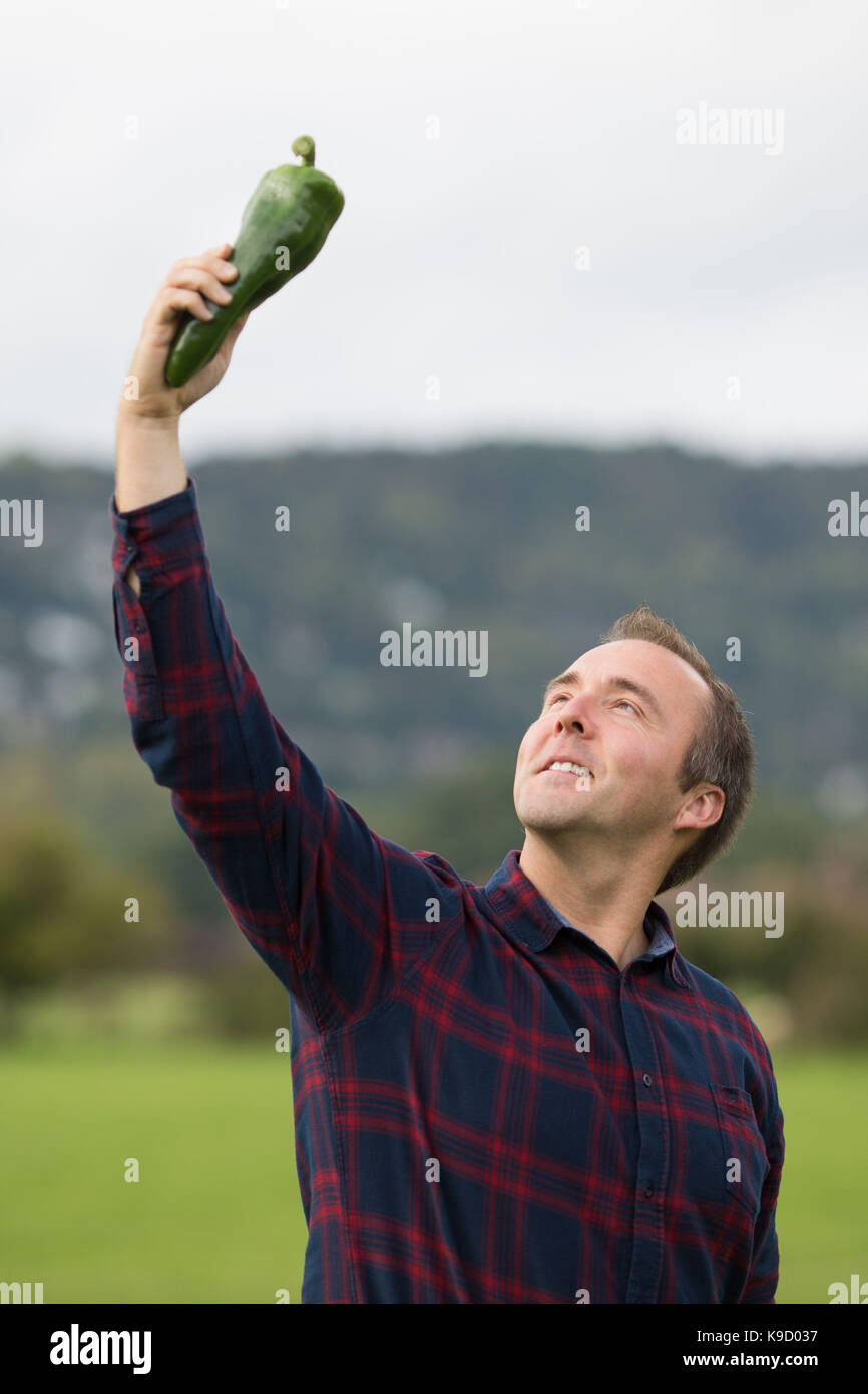 Kevin Forte holds his Poblano chili weighing 0.348kg, during the press ...