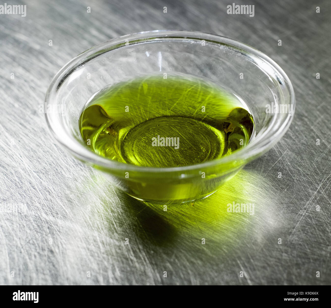 extra virgin olive oil in a little bowl on a stanless steel table Stock ...