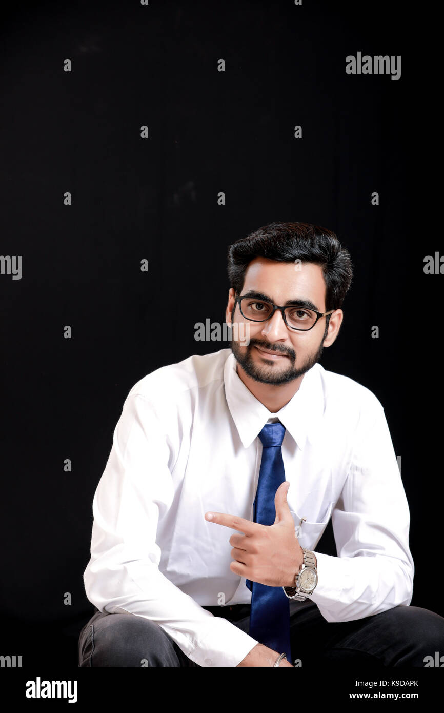 Indian young man showing direction with hand Stock Photo - Alamy