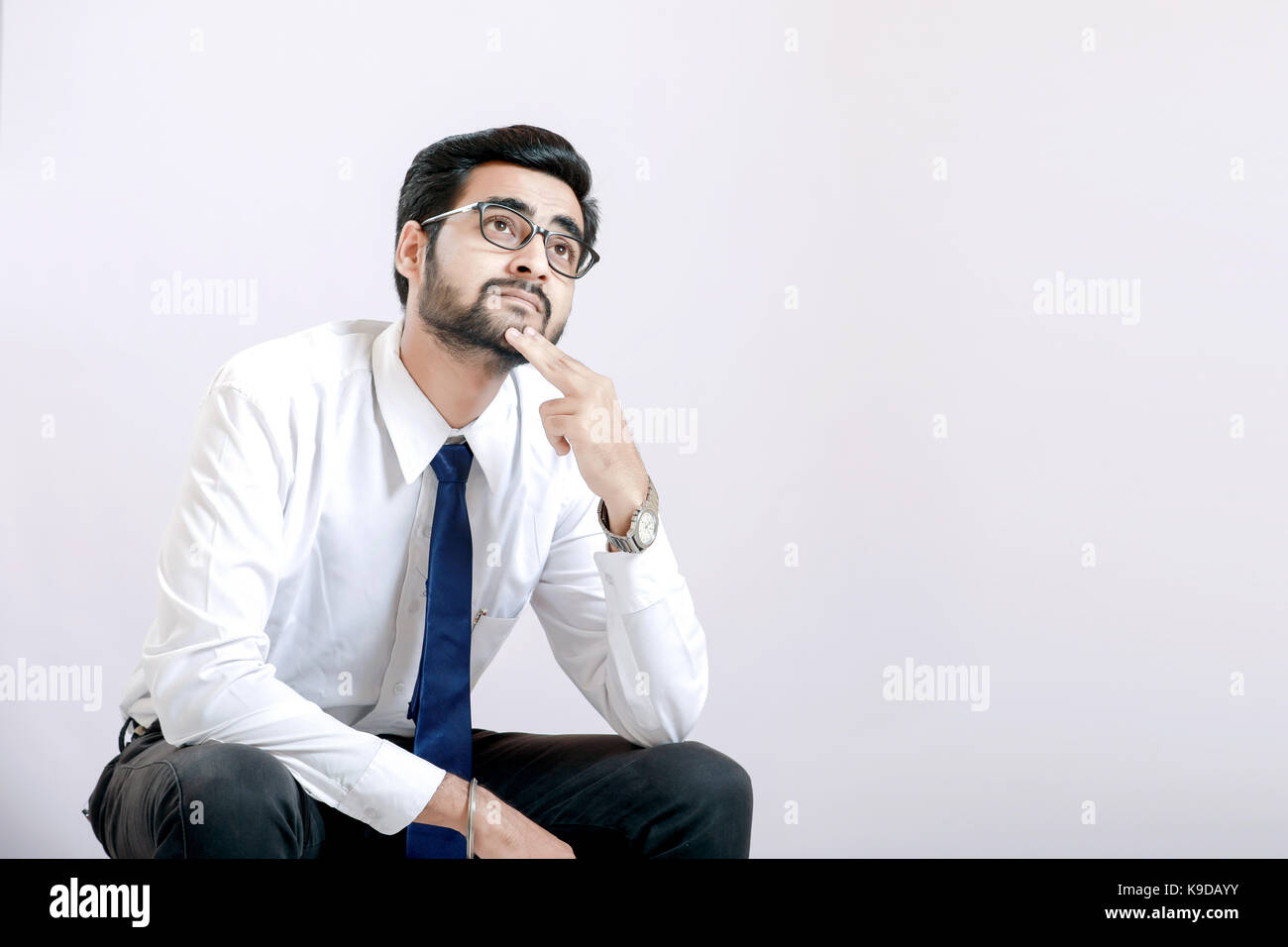Happy thoughtful indian man looking hi-res stock photography and images ...