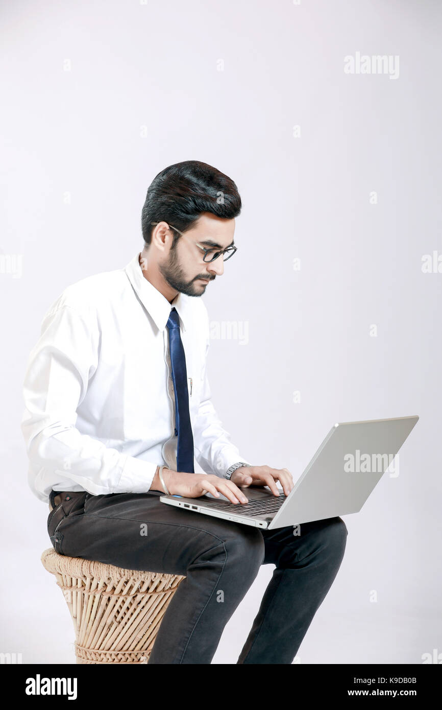 Indian young man with laptop Stock Photo - Alamy