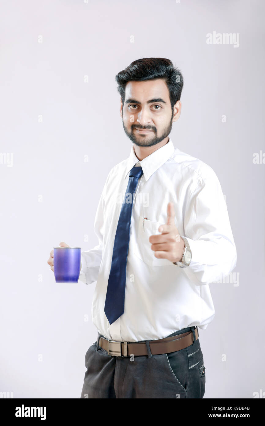 indian young man holding cup in hand Stock Photo - Alamy