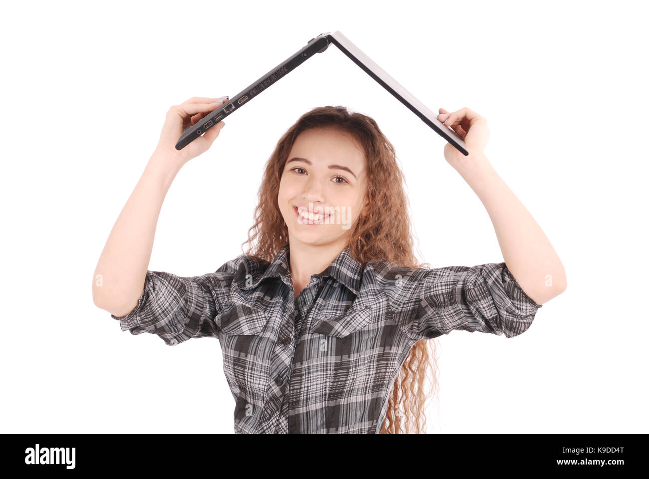 Young girl standing and using a laptop, isolated on white Stock Photo ...