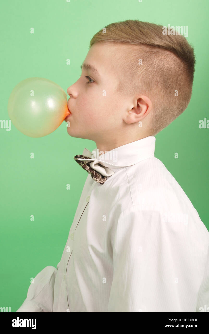 Boy blowing bubble gum hi-res stock photography and images - Alamy