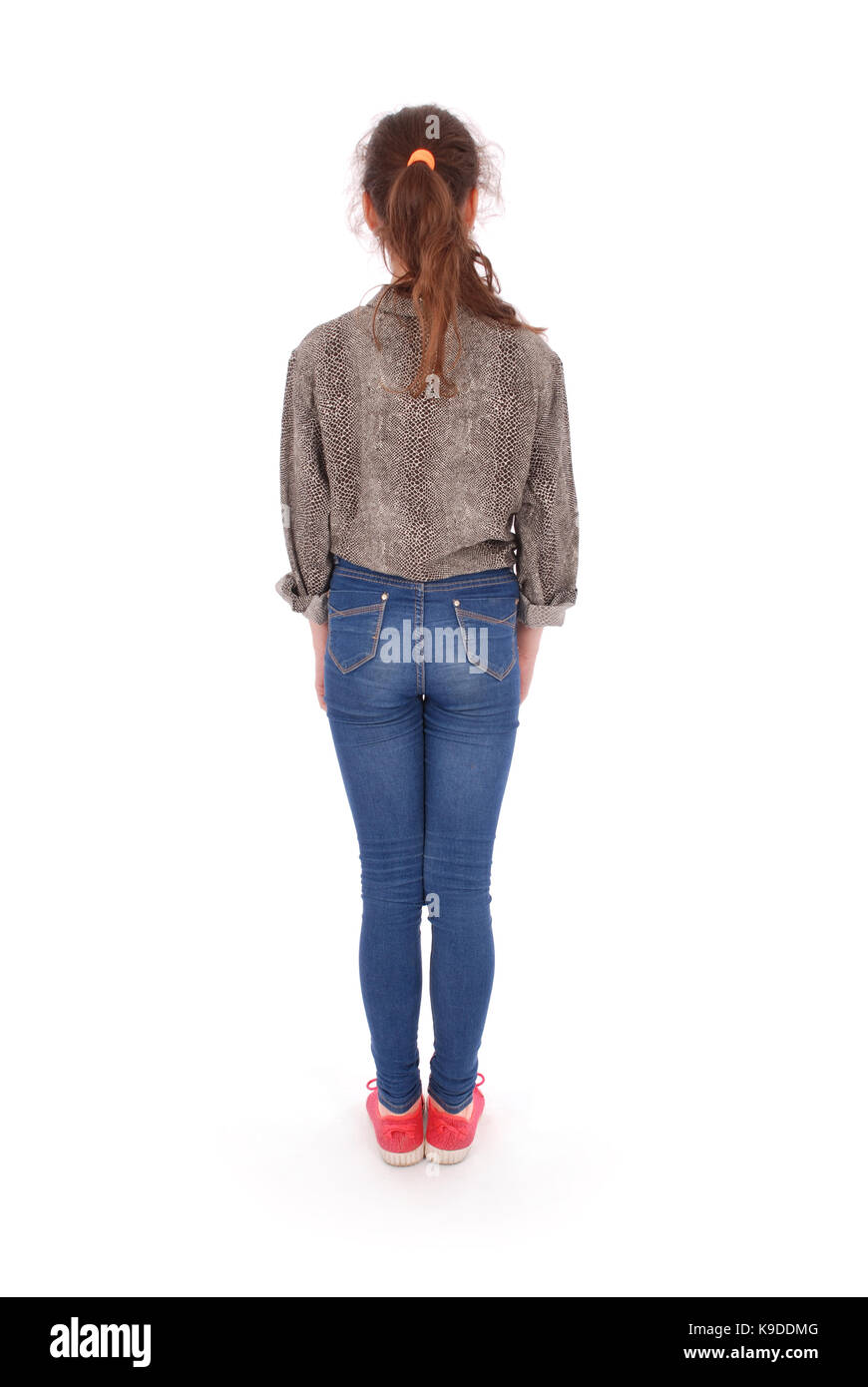 Portrait of a charming smiling girl, turned her back, isolated on a ...