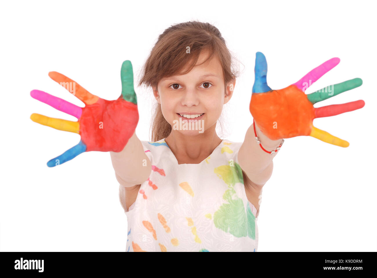 Portrait of adorable smiling little girl, with the colored hands and ...