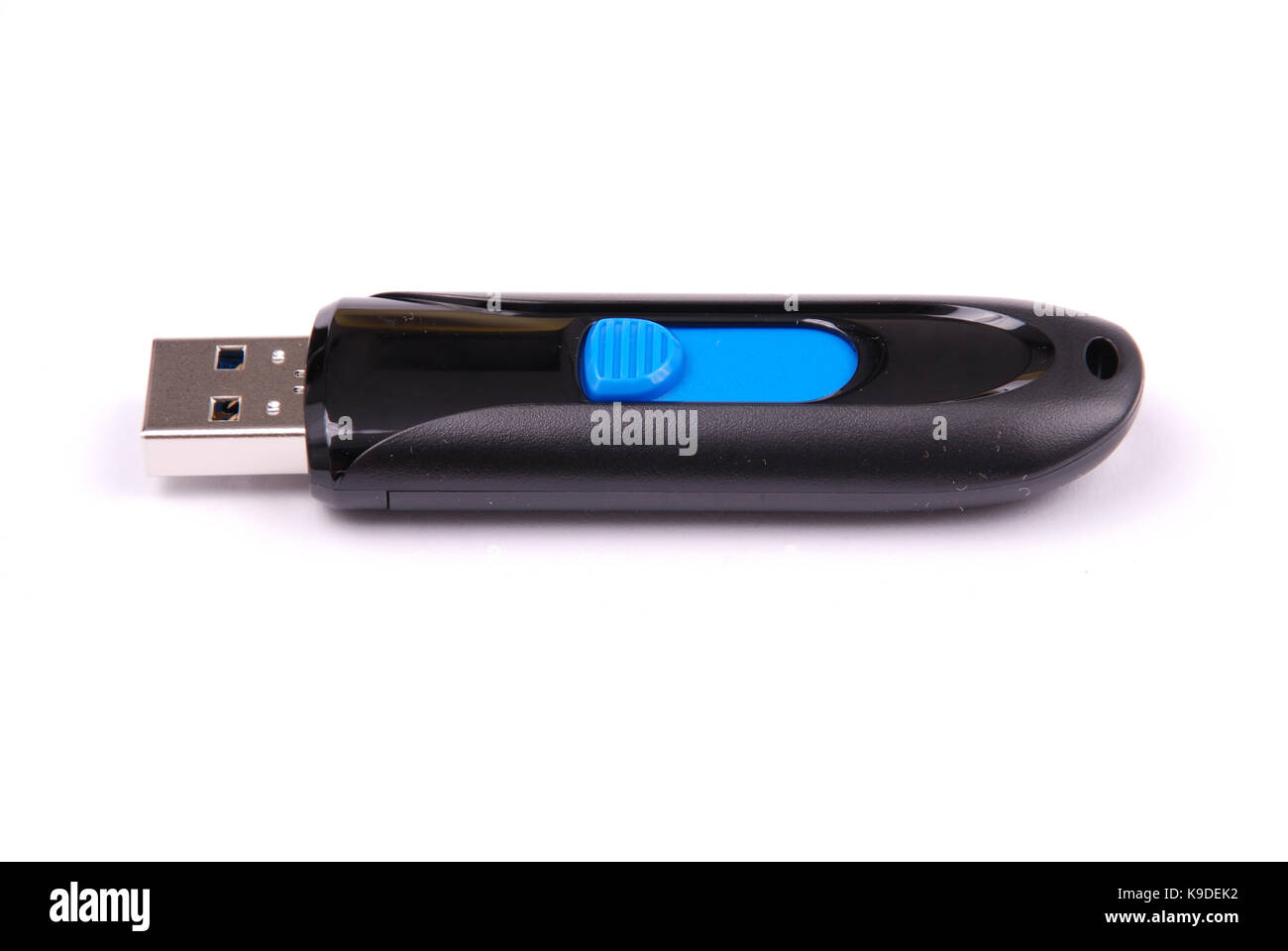 Black and blue USB flash drive isolated on white background with soft ...