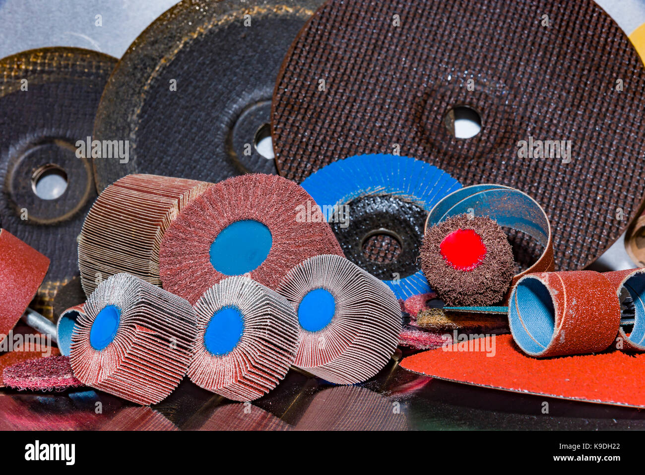 A pile of color abrasive sandpaper for metal working sandpaper for ...