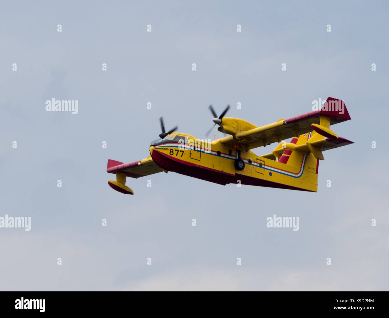 Firefighter airplane, water bomber, air tank taking water from the sea ...