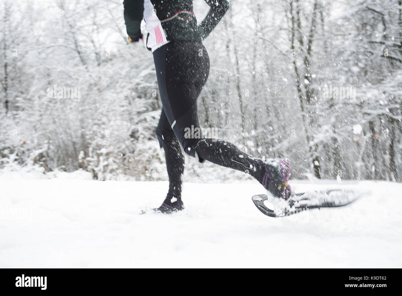 A Fitness running woman in winter season Stock Photo - Alamy