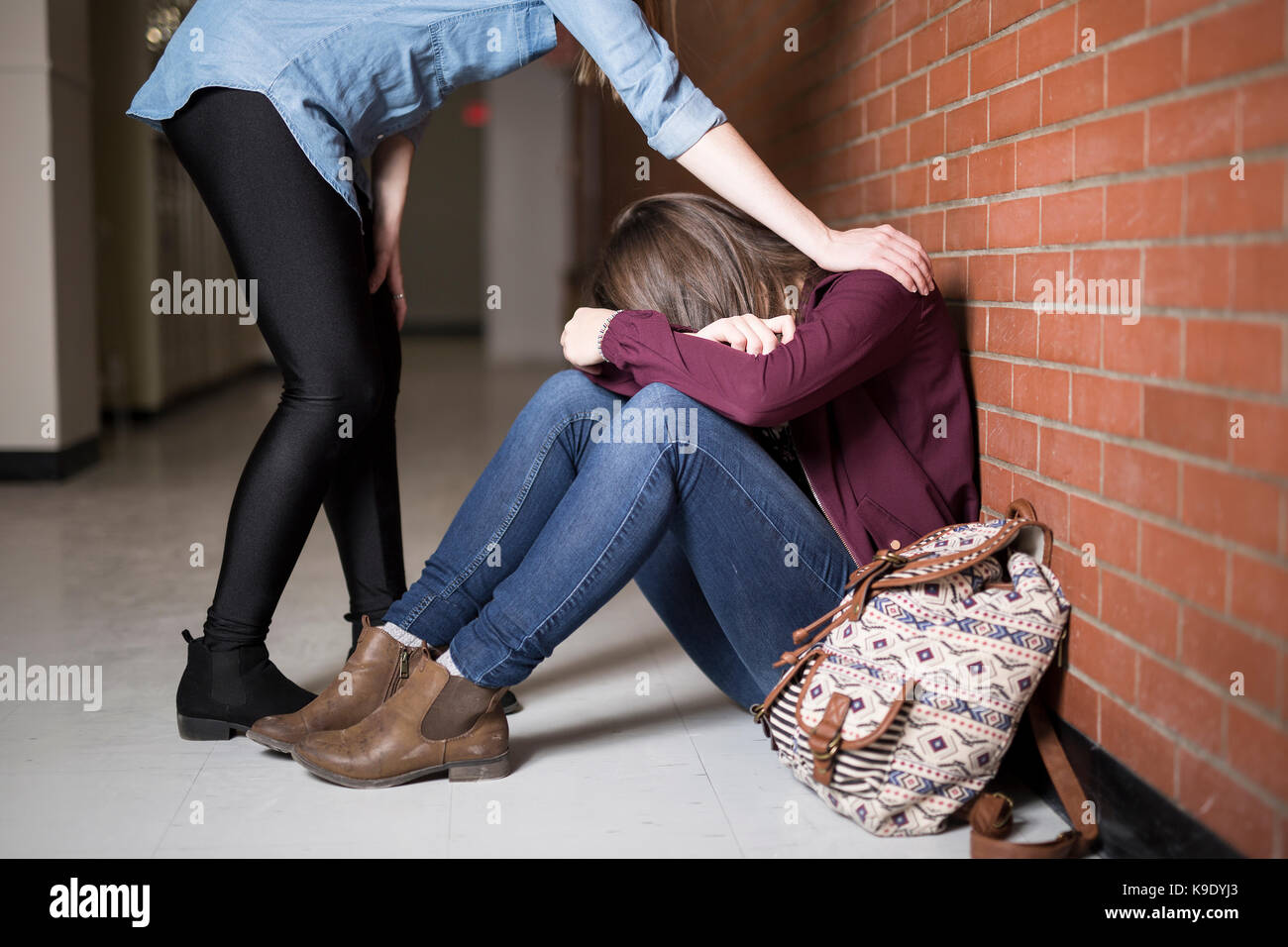 A Young depress female student at the college Stock Photo - Alamy