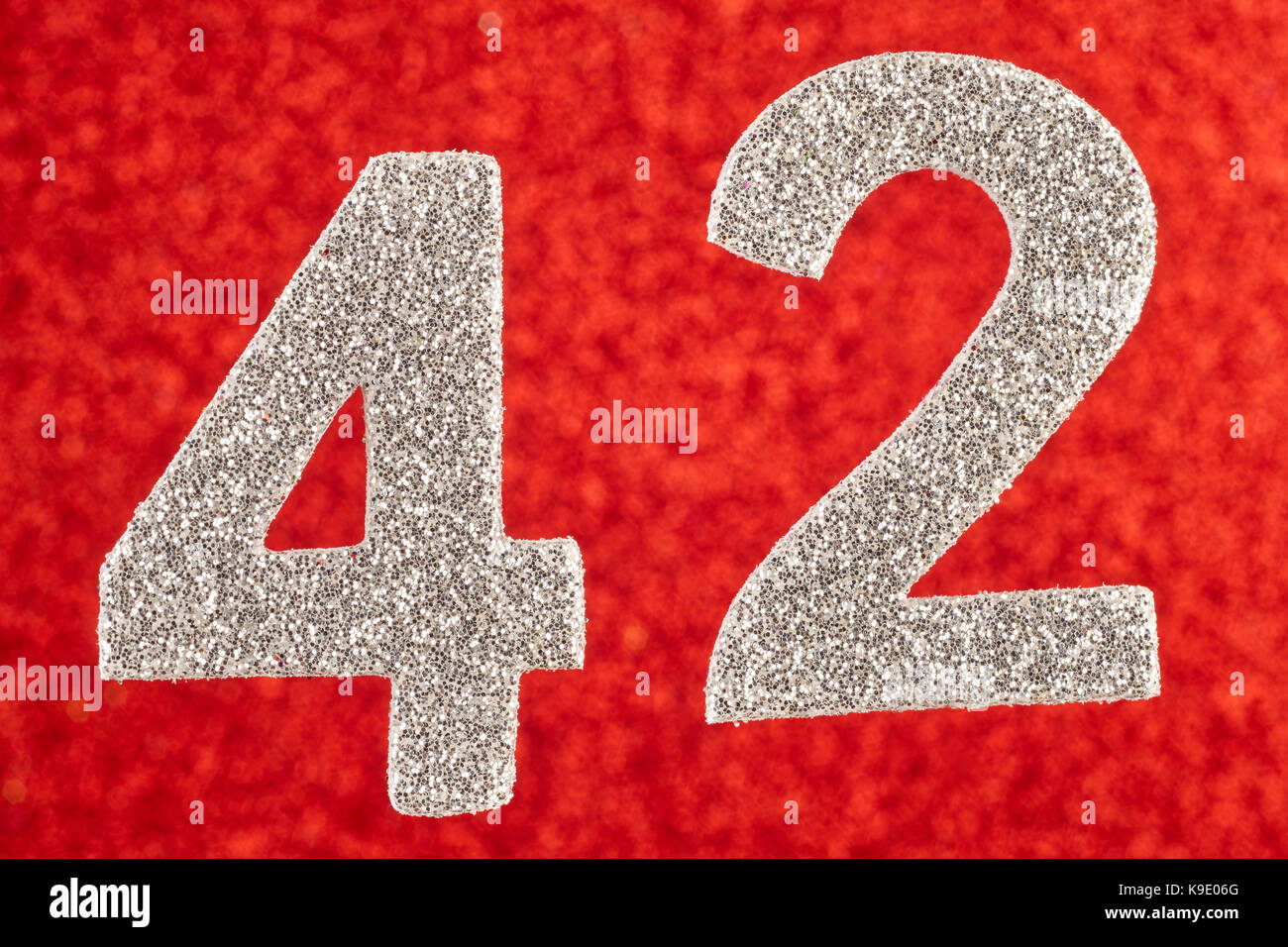 Number forty-two silver color over a red background. Anniversary ...