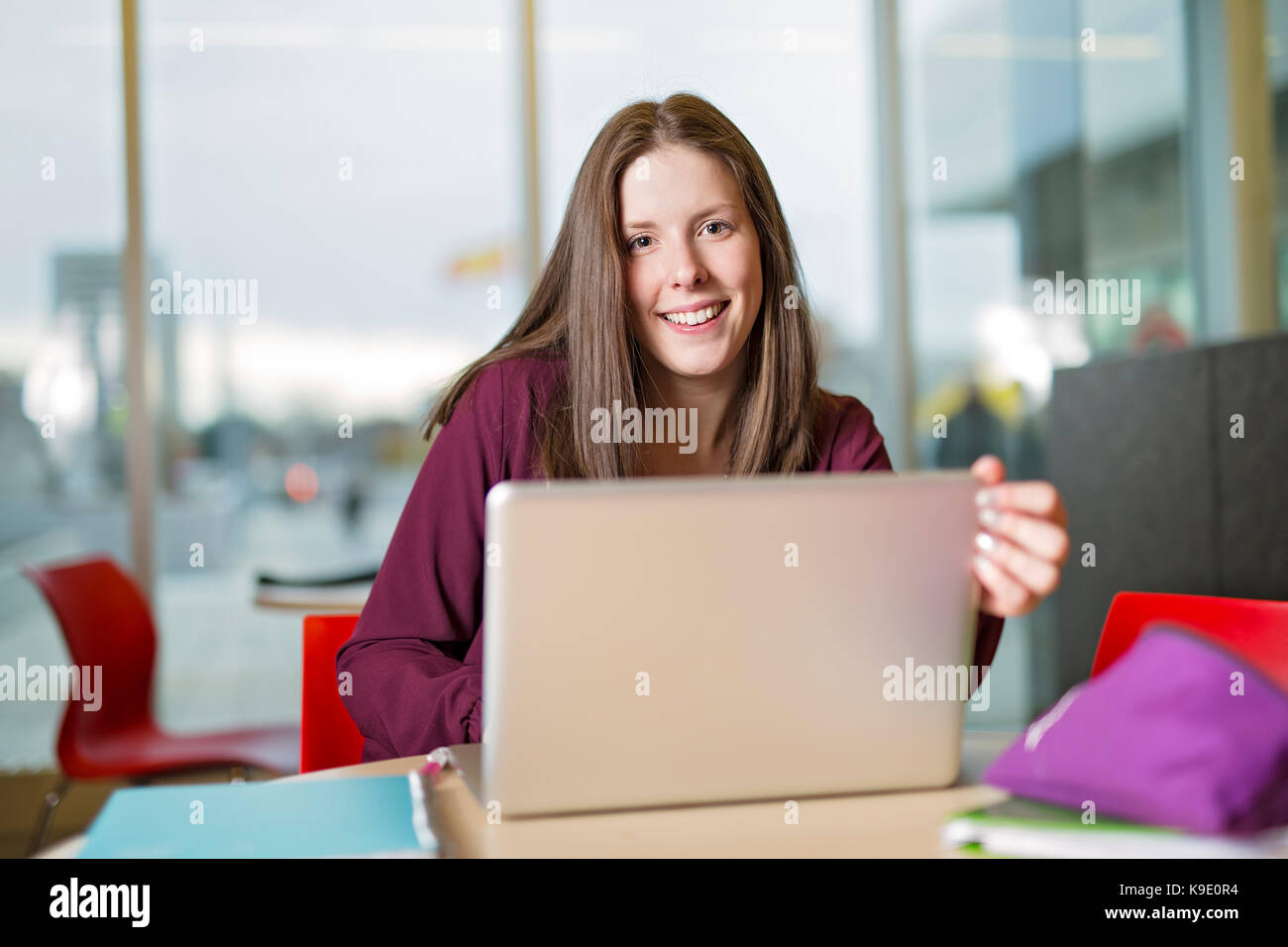 A Happily smiling girl looking at camera Stock Photo - Alamy