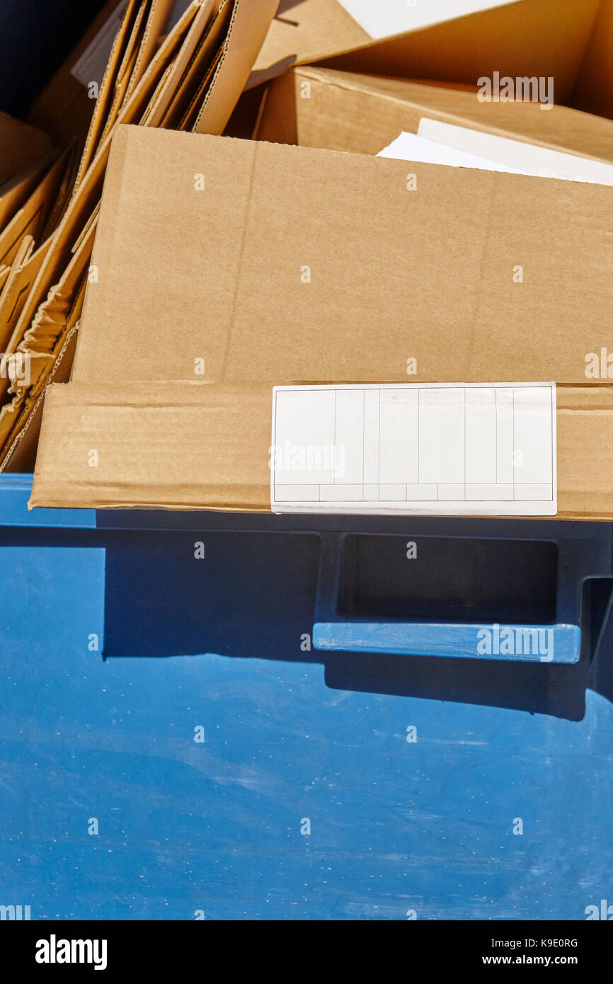 Blue recycling container for paper with cardboard boxes. Environment ...