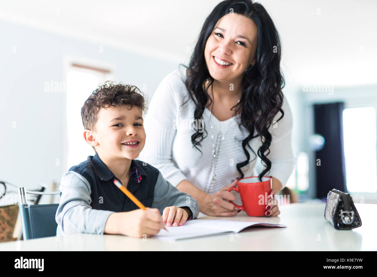 A Mother Helping Son for the Homework at home Stock Photo - Alamy