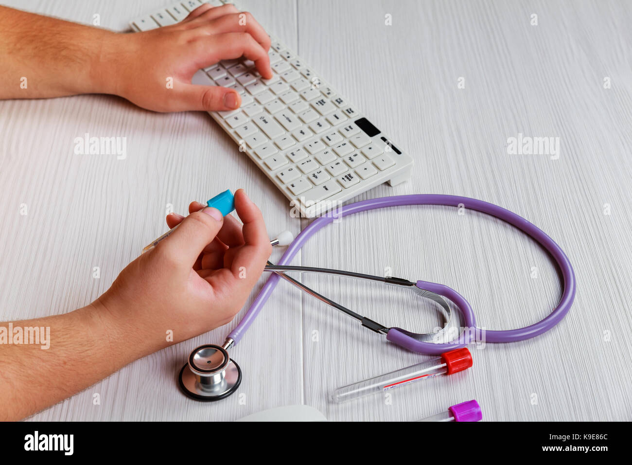 Experiments in the laboratory hands of the doctor at the table holds in ...