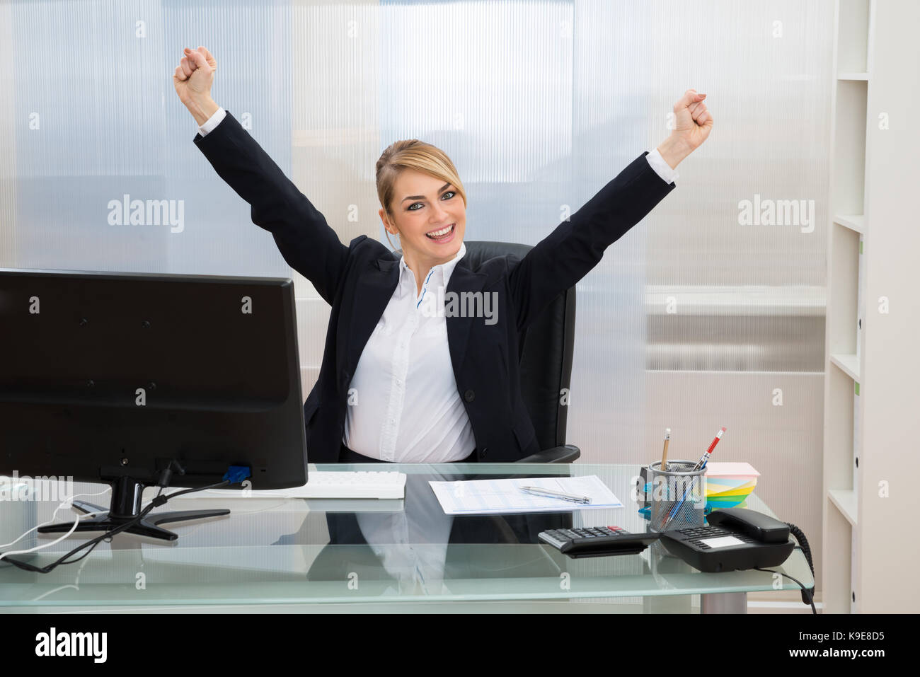 Young Happy Businesswoman Raising Hands In Office Stock Photo - Alamy