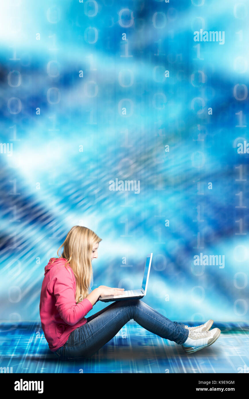 blonde teenager girl with a laptop, studying, searching or chatting ...