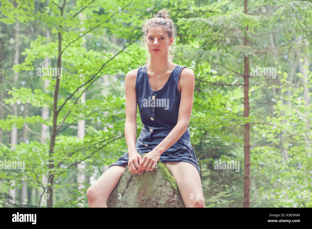 Beautiful woman enjoying forest Stock Photo - Alamy