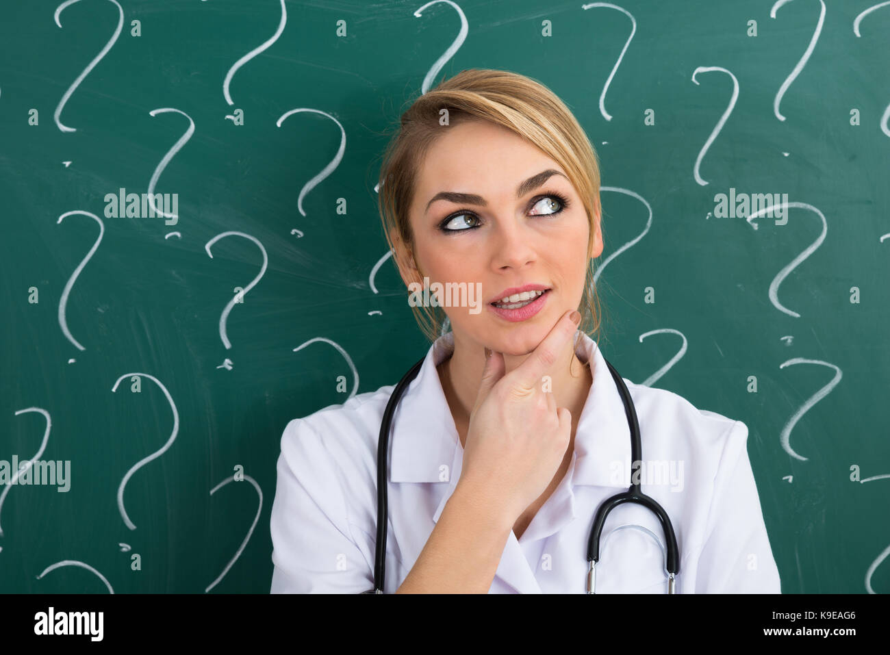 Thoughtful doctor standing white hi-res stock photography and images ...