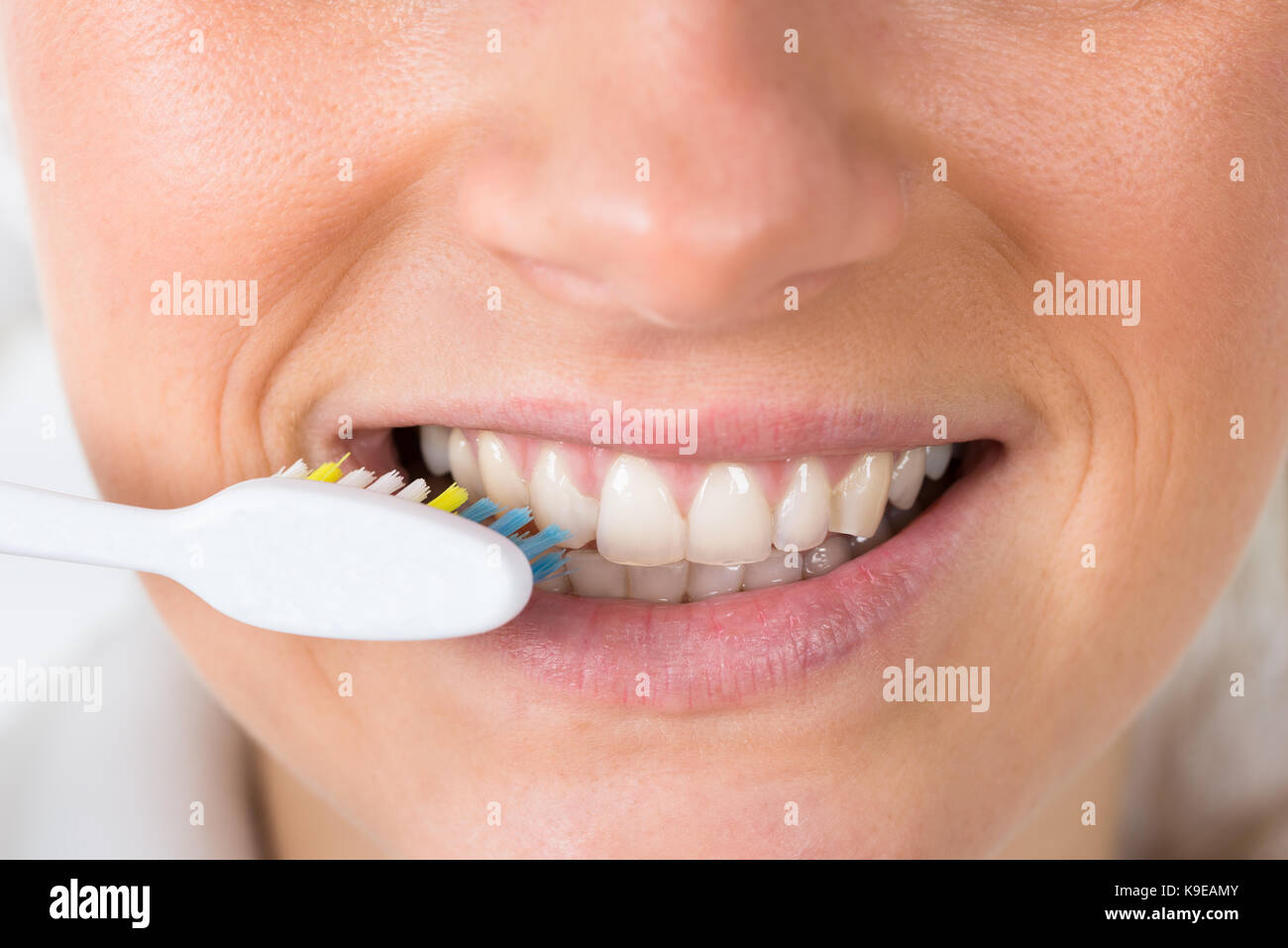 Close-up Of A Woman Brushing Teeth With Toothbrush Stock Photo - Alamy