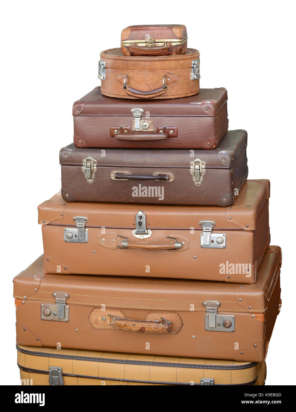 Seven old suit case isolated on white background Stock Photo - Alamy