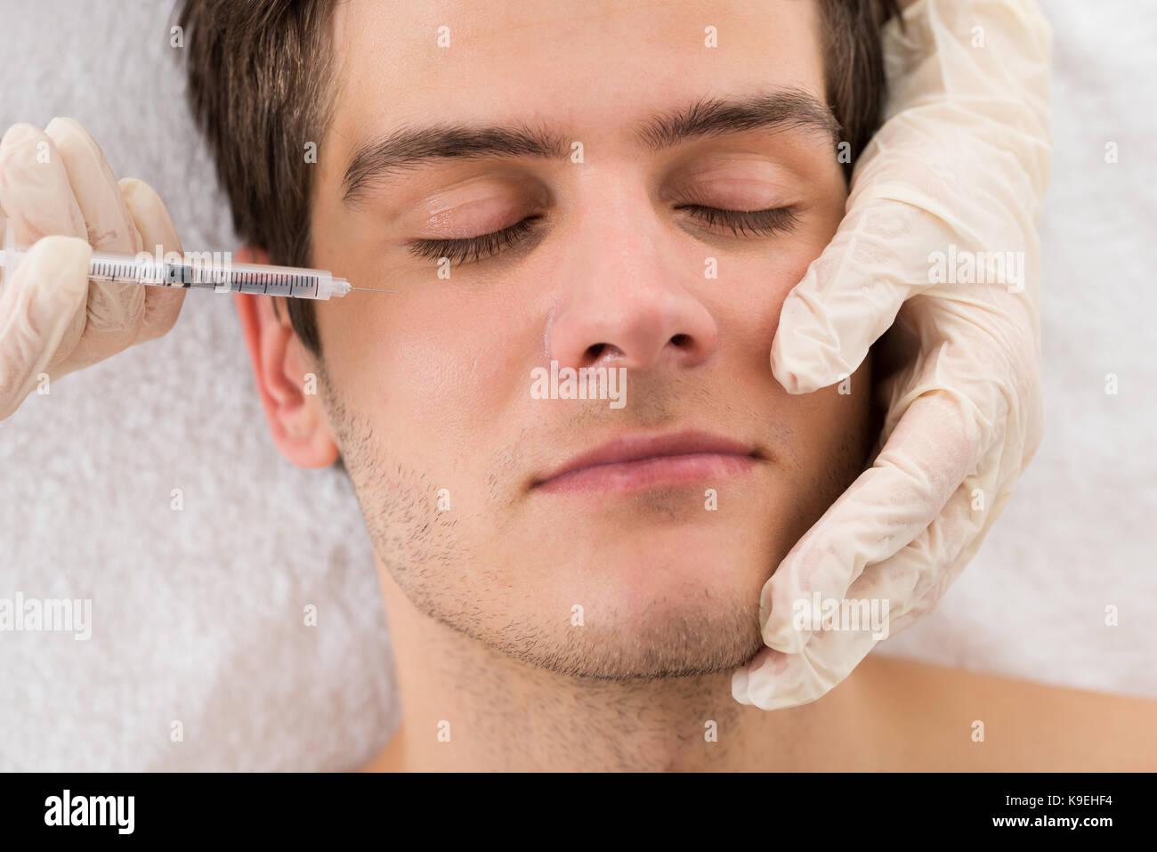 Close-up Of Man Receiving Wrinkle Treatment On Face In Beauty Clinic ...