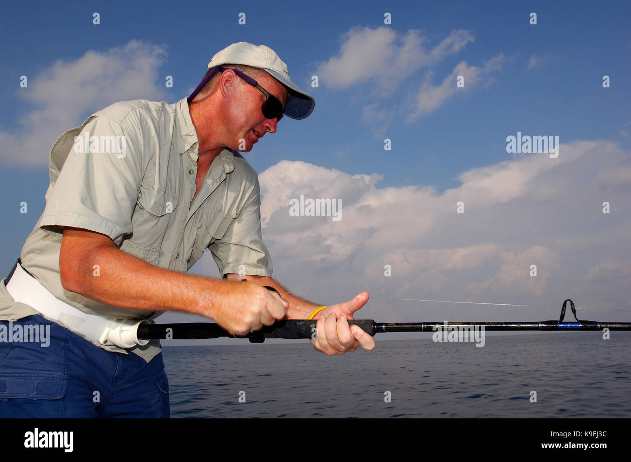 A fisherman deep sea fishing near Port Aransas, Texas Stock Photo - Alamy