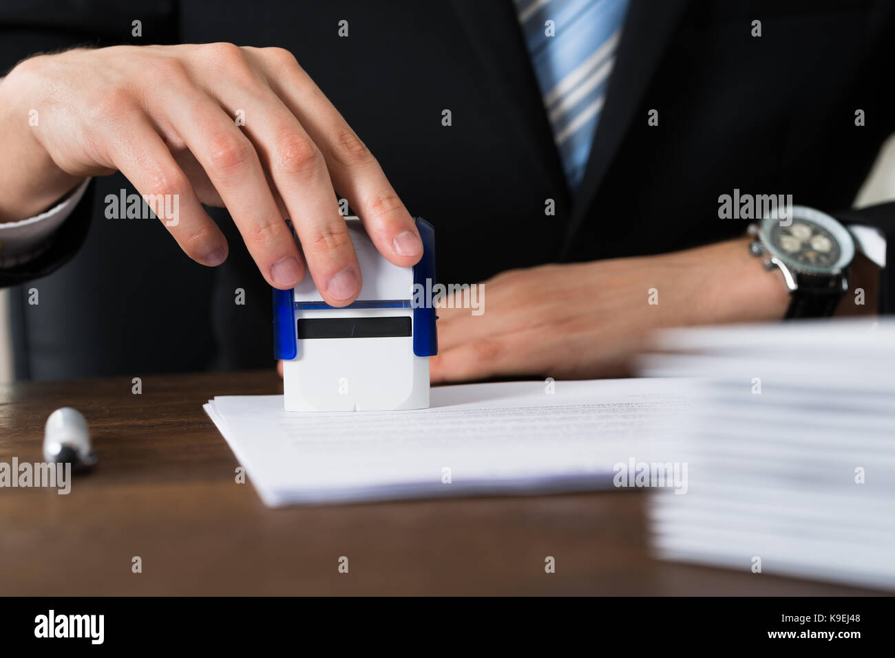 Businessman holding stack paper hi-res stock photography and images - Alamy