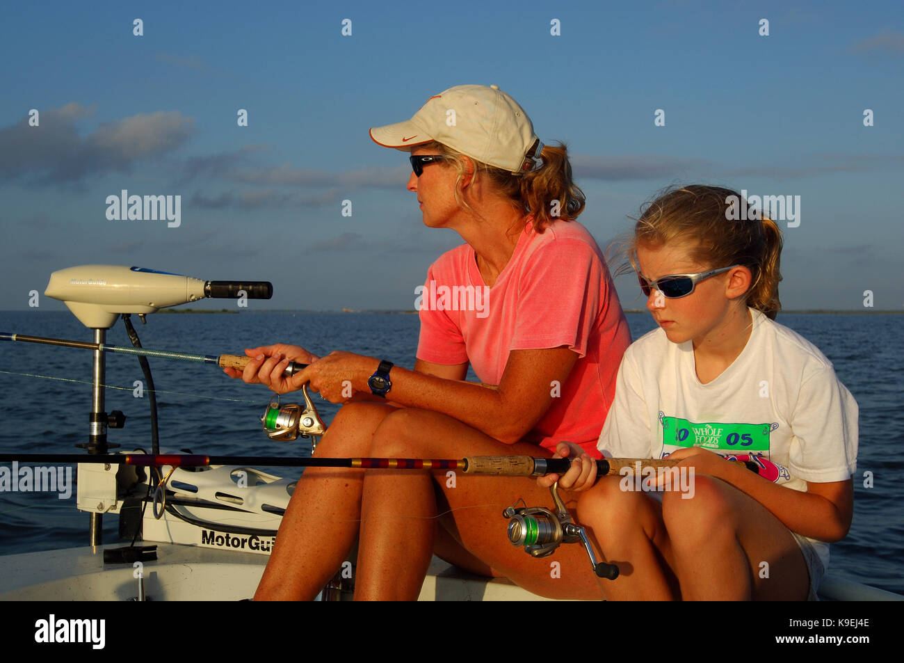 A mother and daughter fishing in the bay near Port Aransas, Texas Stock ...