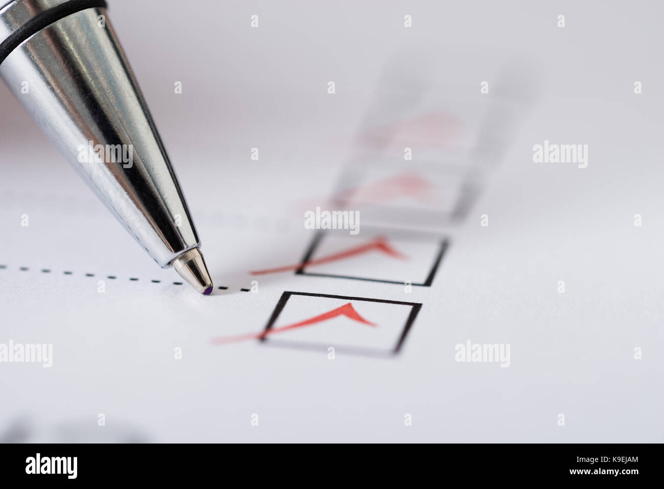 Close-up Of Silver Pen Over Filled Checkboxes In Form Stock Photo - Alamy