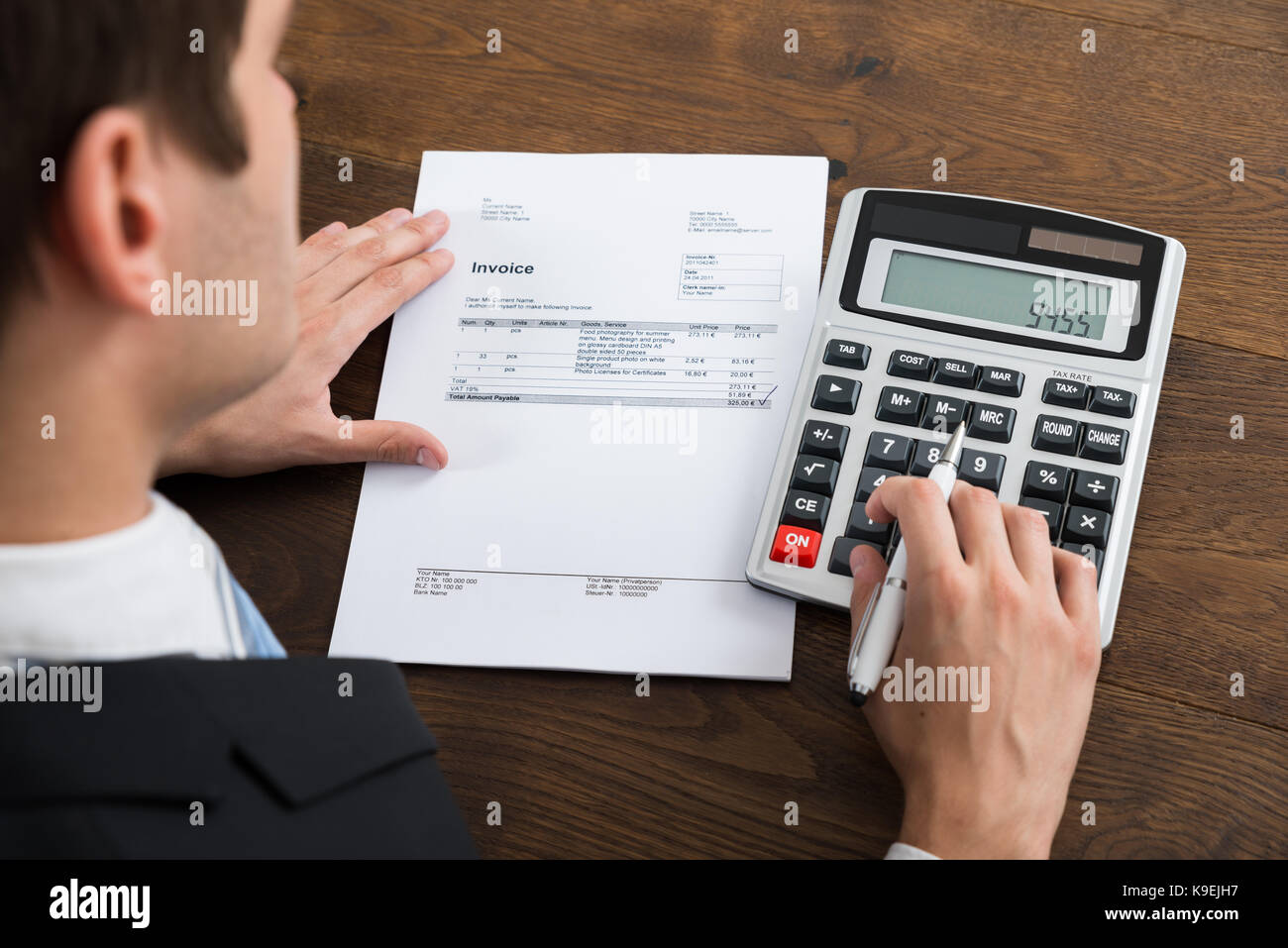 Close-up Of Businessperson Calculating Tax With Calculator In Office ...