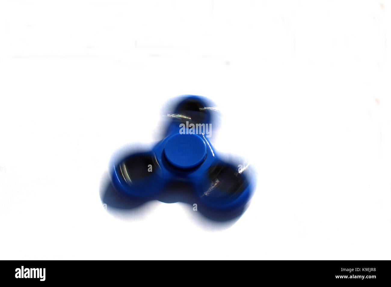 Rotating fidget spinner Cut Out Stock Images & Pictures - Alamy