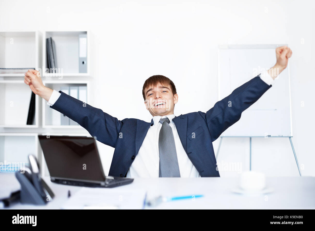 Relaxed happy young business man after working at the office Stock ...