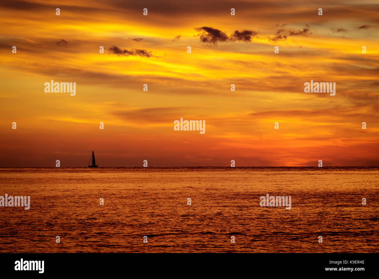 Sunrise over the pinarello bay with a lost sailing ship Stock Photo - Alamy