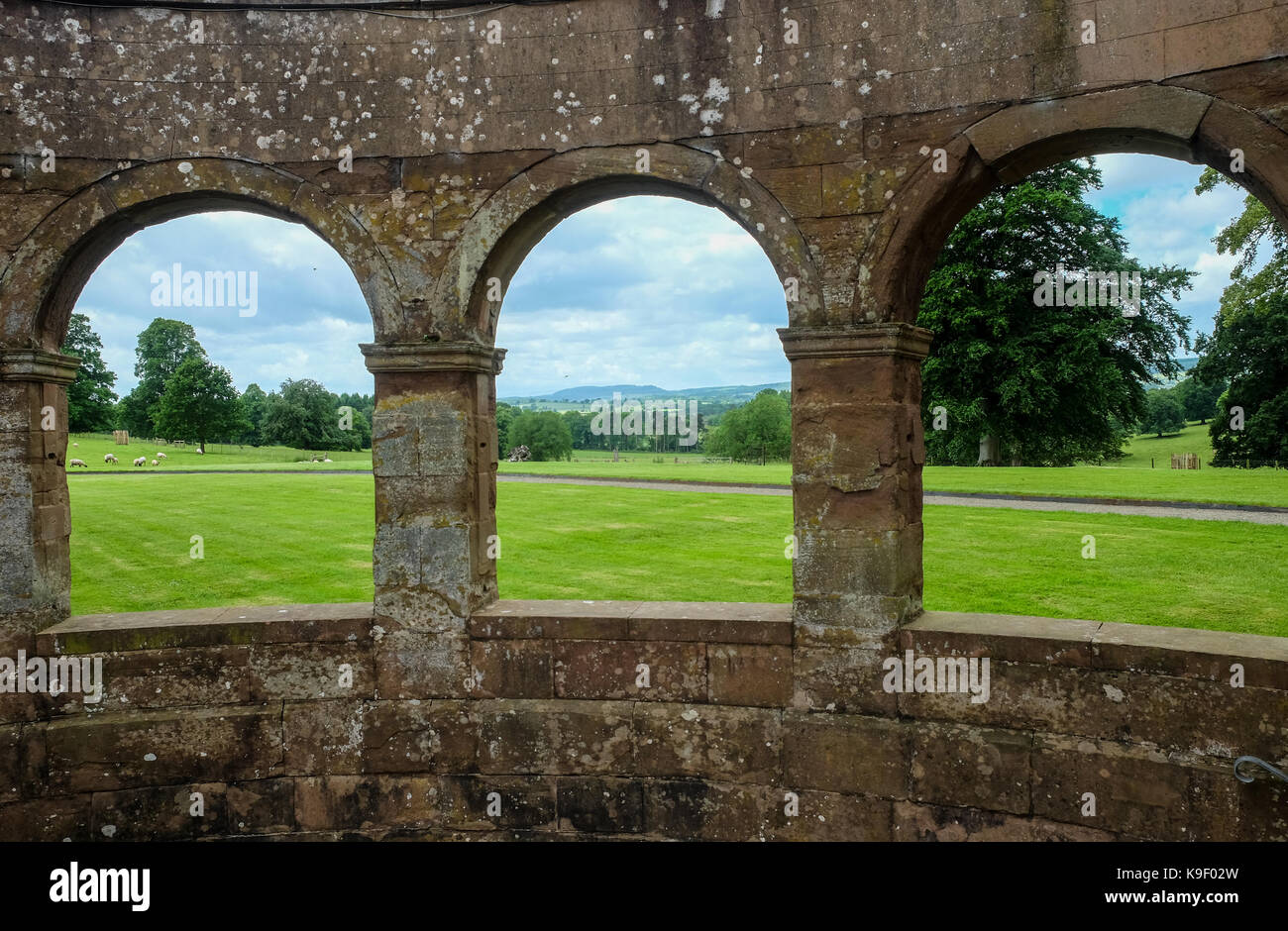 Garden view through arch Stock Photo - Alamy