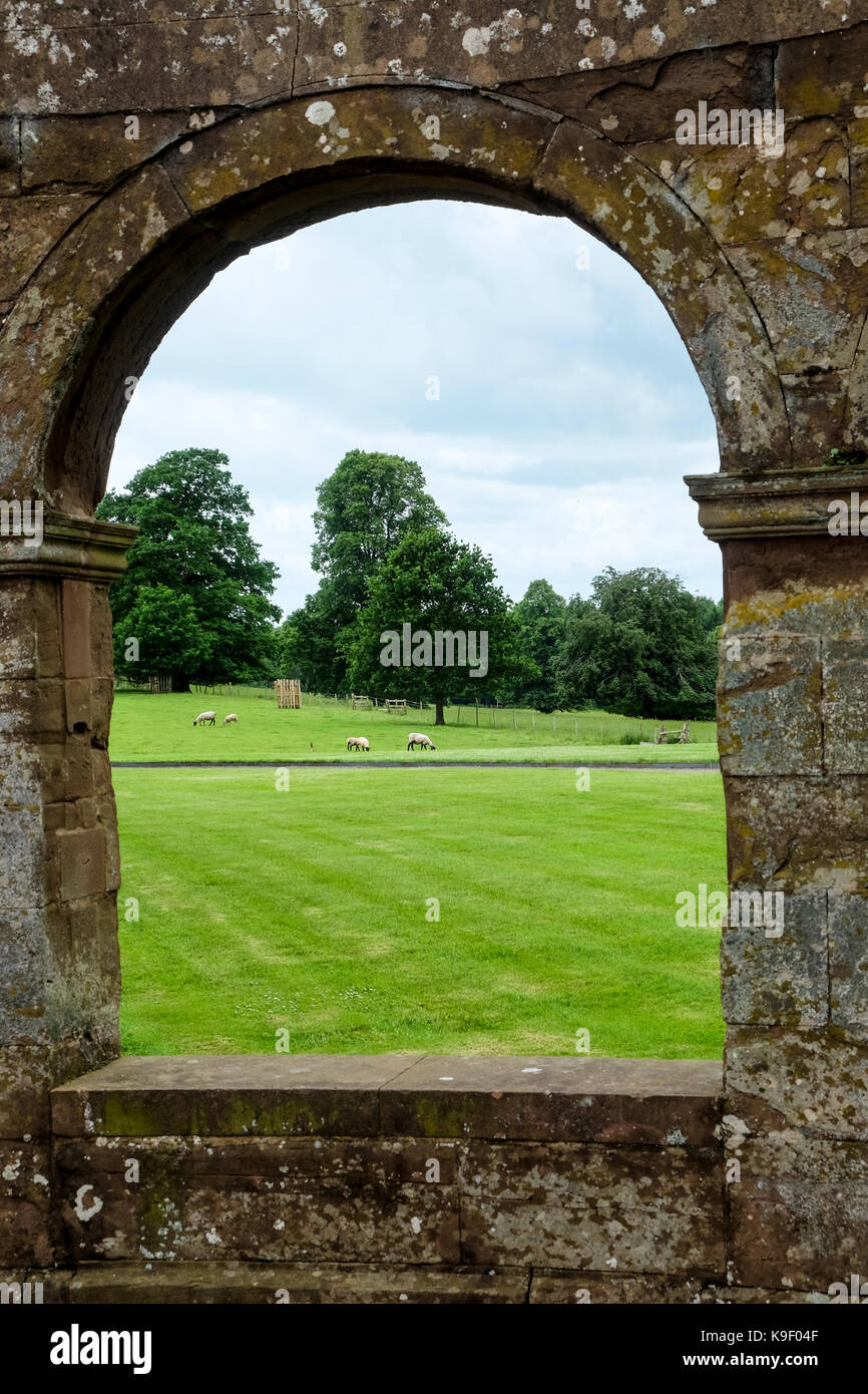 Garden view through arch Stock Photo - Alamy