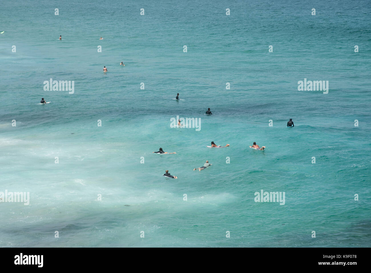 SYDNEY,NSW,AUSTRALIA-NOVEMBER 21,2016: Surfers floating on surfboards ...