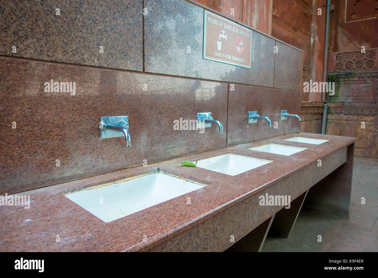 Indoor view of a faucets in the bathroom of Taj Mahal historic place in ...