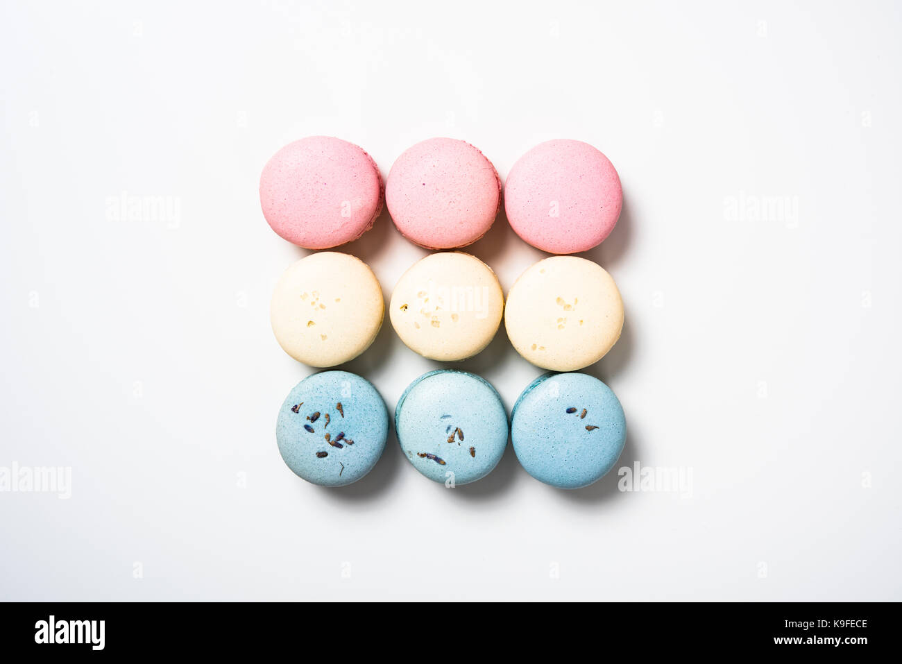 Colorful assorted macaroon cookies on white background, european ...