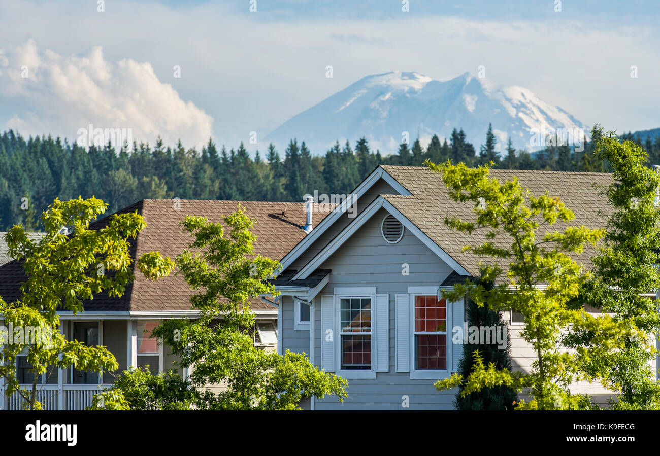 Residential homes with a volcano in the distance, Snoqualmie Ridge ...