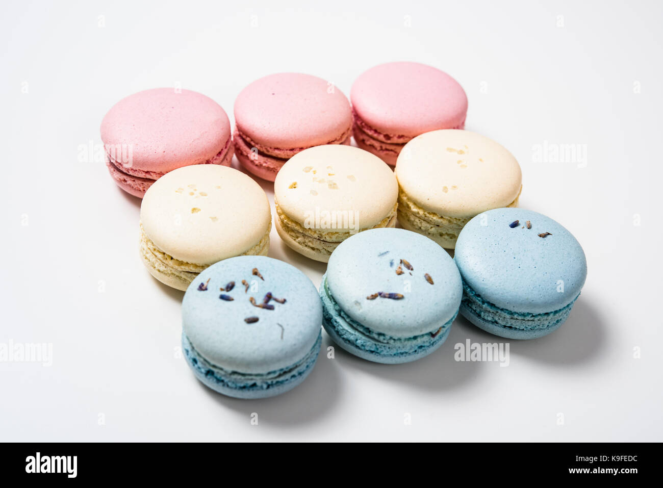 Colorful assorted macaroon cookies on white background, european ...