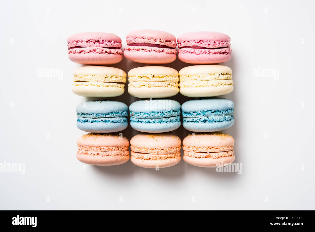 Colorful assorted macaroon cookies on white background, european ...