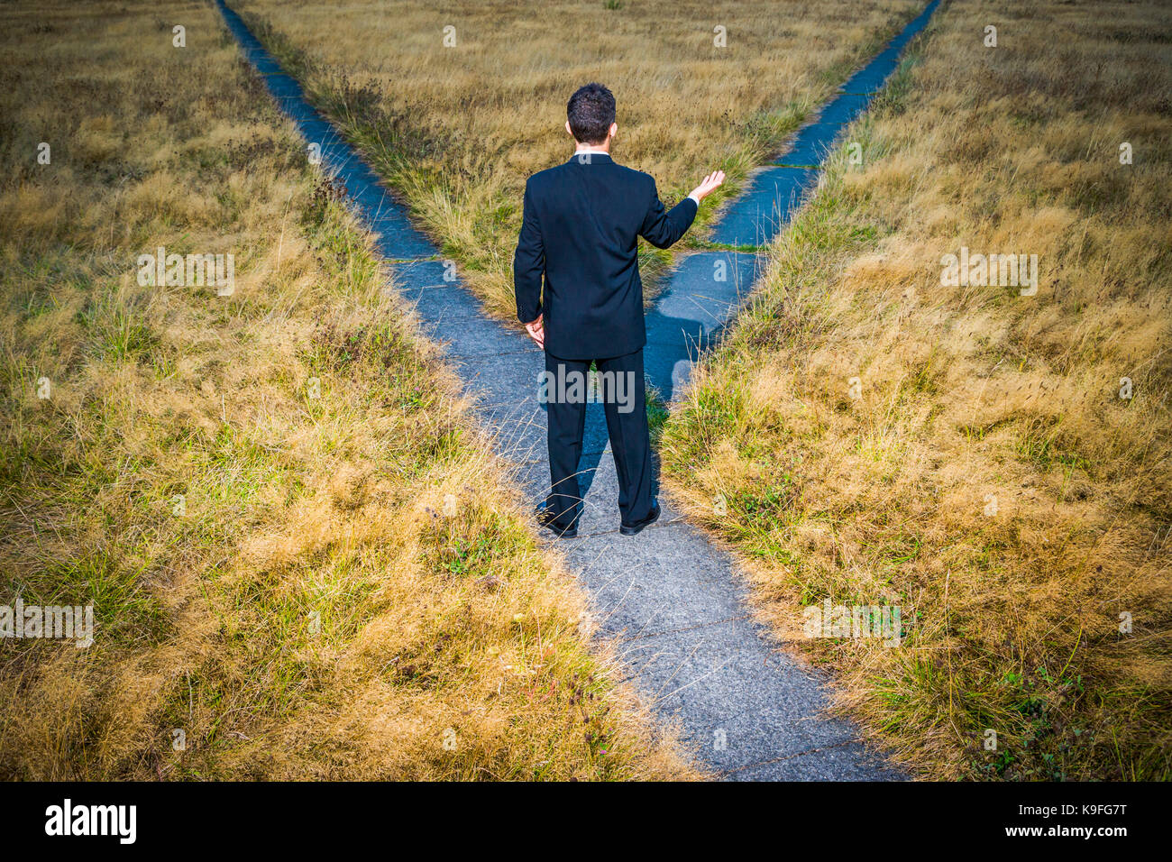 Man in suit at the crossroads hi-res stock photography and images - Alamy