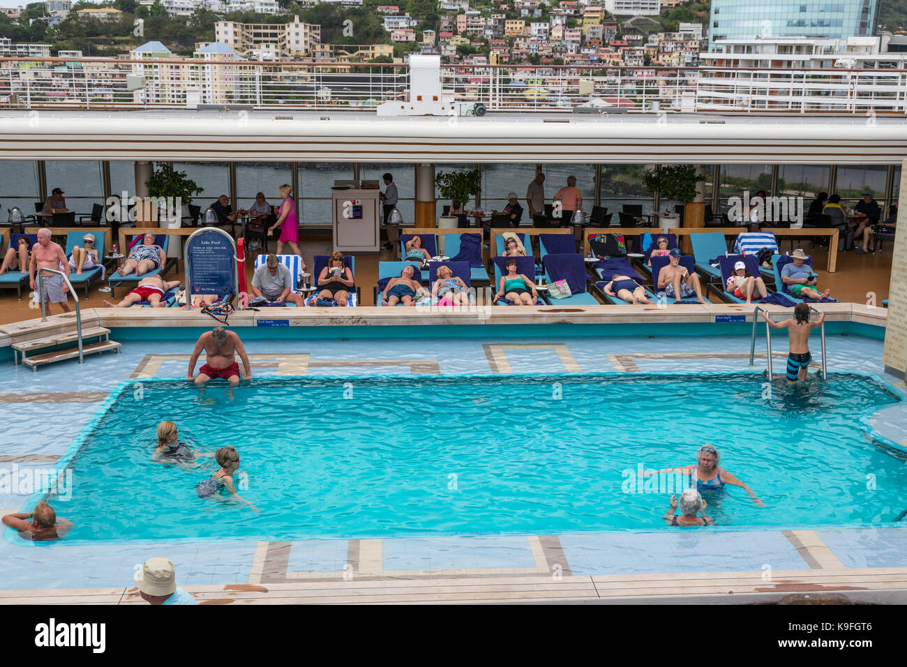Caribbean Cruise Ship Passengers Relaxing around the Onboard Swimming ...