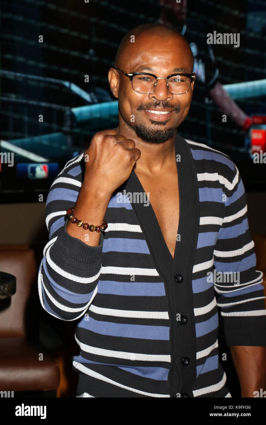 Boxing Champ Sugar Shane Mosley cuts the ribbo and places honorary ...