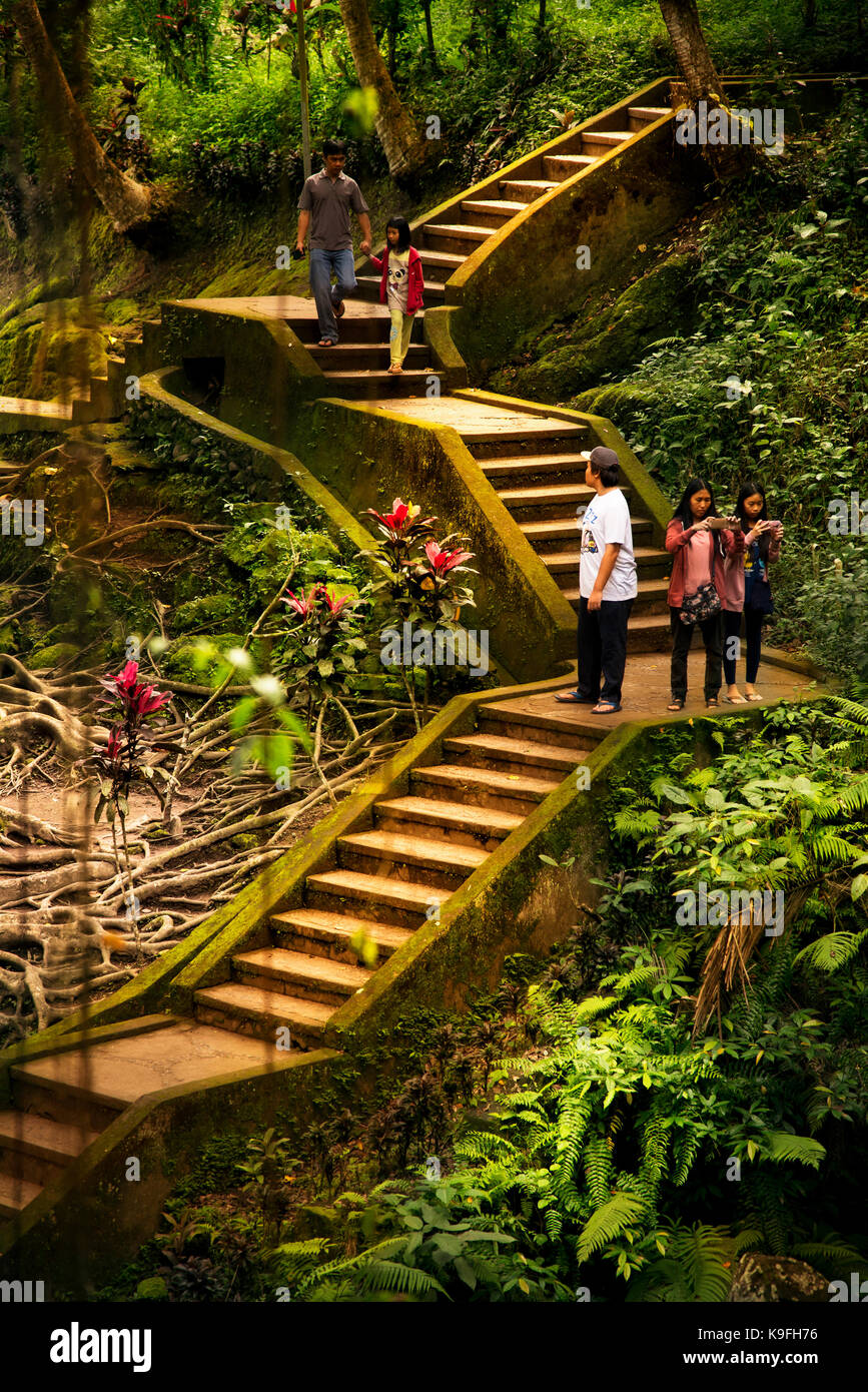 Bali, Indonesia - July 06, 2017. Stairs and roots and some tourists in ...