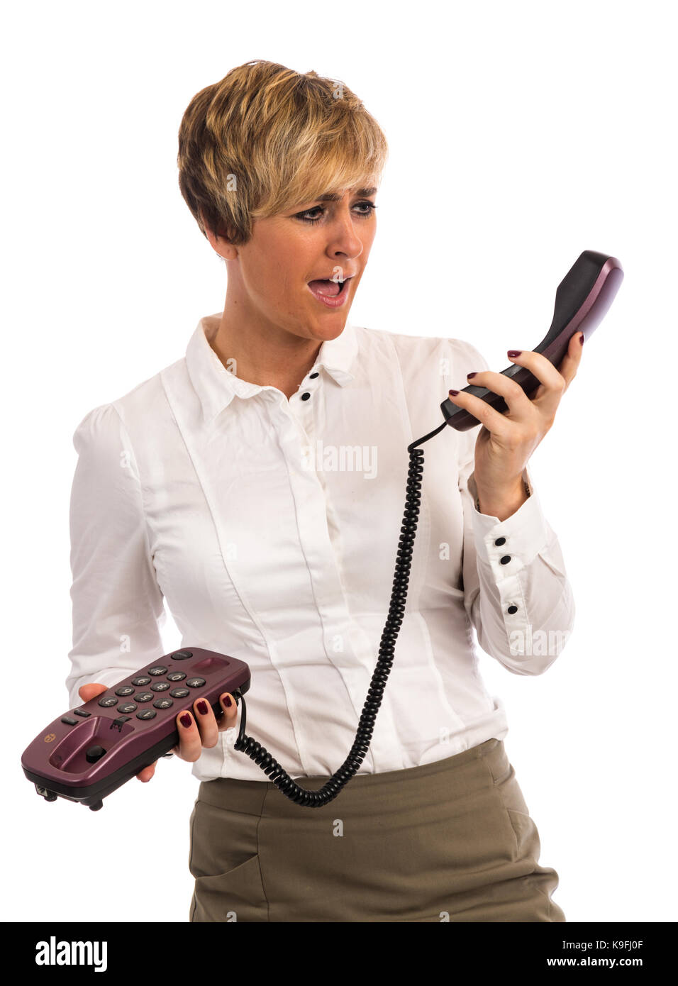 An angry business woman on phone Stock Photo - Alamy