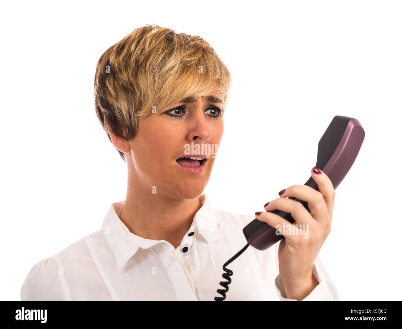 An angry business woman on phone Stock Photo - Alamy