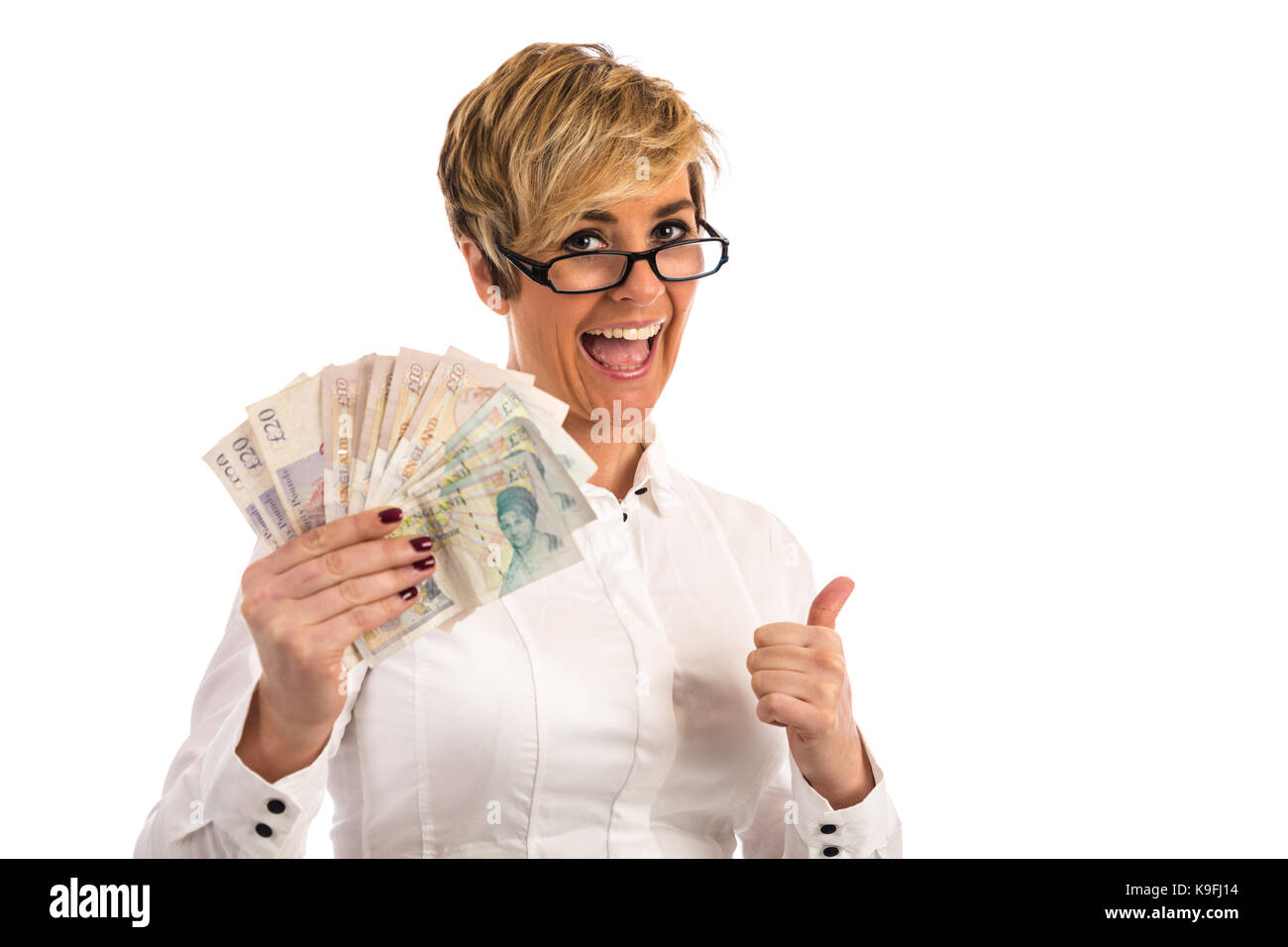 A succesful business woman with a handful of cash Stock Photo - Alamy